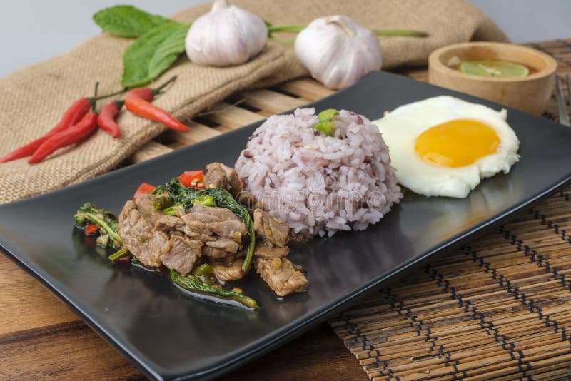 Stir-fried Beef Basil with Fried Egg and Riceberry Rice Stock Photo ...