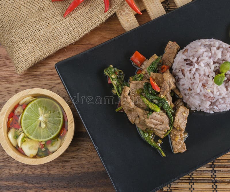 Stir-fried Beef Basil with Fried Egg and Riceberry Rice Stock Photo ...