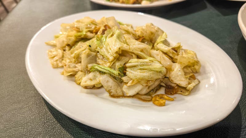 Stir-fried Cabbage with Fish Sauce, Thai Food on the White Plate Stock ...