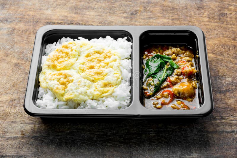 Stir Fried Chicken with Basil Over Rice and Omelette Stock Photo ...