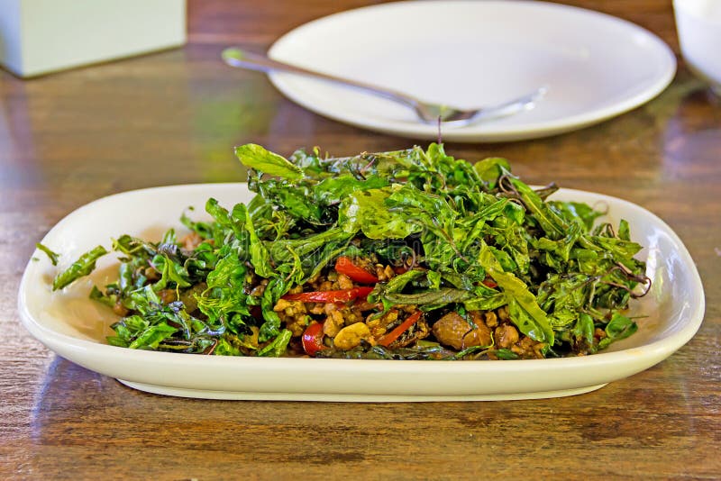Stir Fried Crispy Basil with Pork and Black Preserved Eggs. Stock Image ...