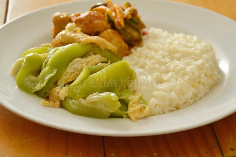 Stir Fried Gourd with Egg and Spicy Fish Ball on Rice Stock Photo ...