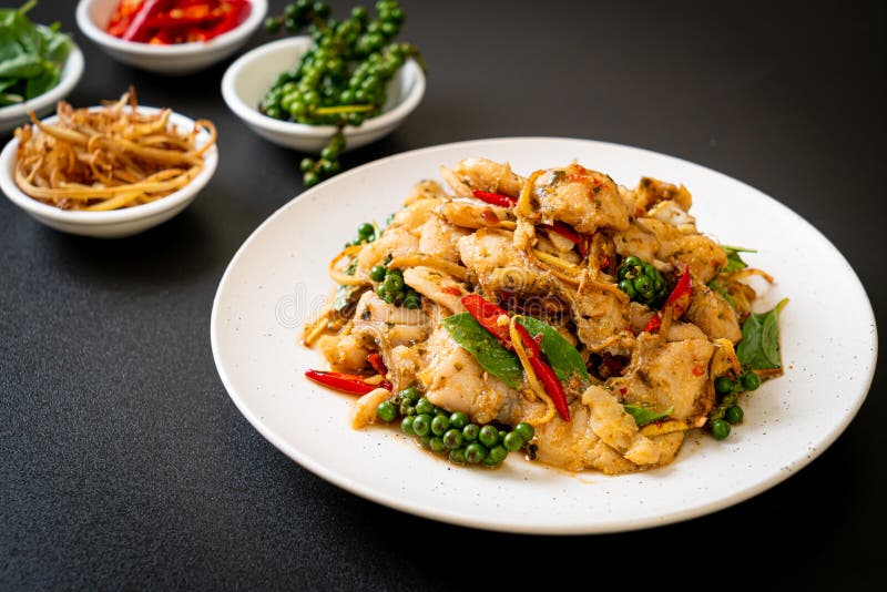 Stir Fried Holy Basil with Fish and Herb Stock Photo - Image of garlic ...