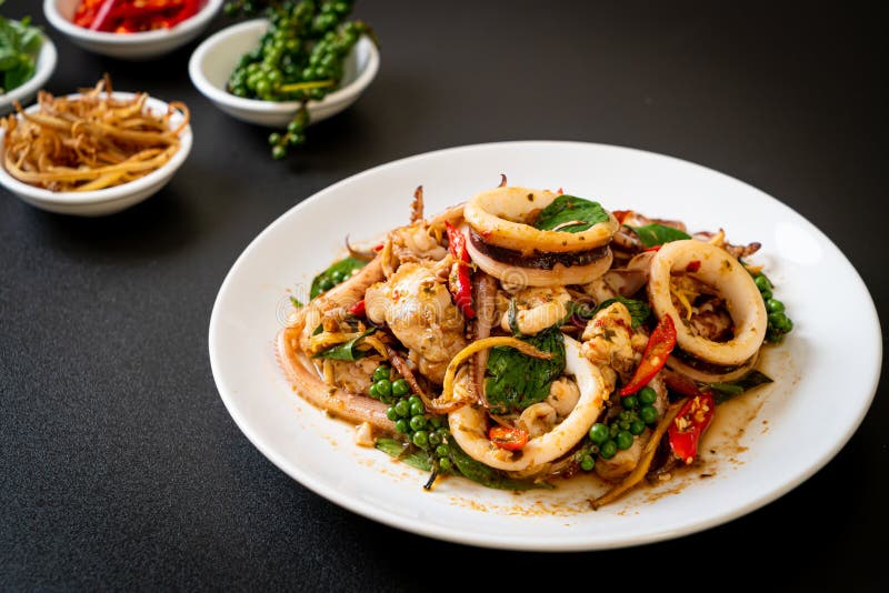 Stir Fried Holy Basil with Octopus or Squid and Herb Stock Image ...