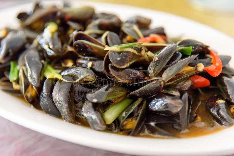 Stir-fried mussels. stock image. Image of diet, traditional - 333862919
