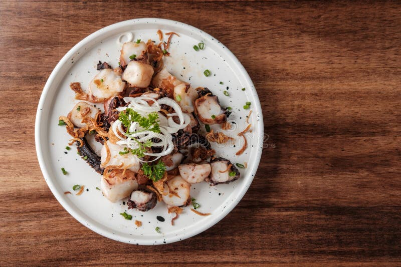 Stir-fried Octopus on a White Plate Stock Photo - Image of restaurant ...