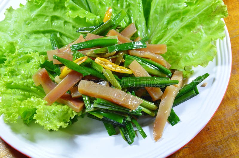 Stir Fried Pickled Crispy Squid with Garlic Chives and Lettuce on Dish ...