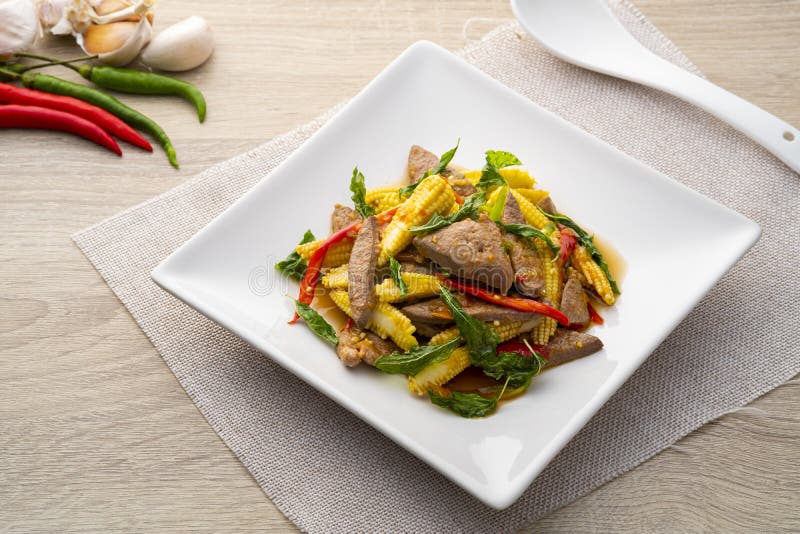 Stir Fried Pork Liver with Baby Corn, Chilli and Basil Leaves Stock ...