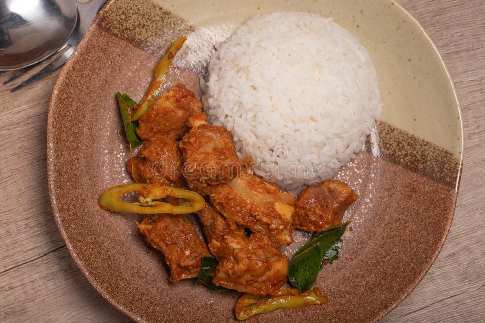 Stir-fried Pork Ribs with Curry Paste and Steamed Rice Stock Image ...