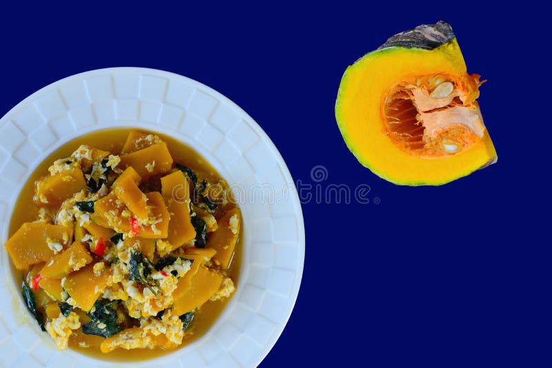Stir Fried Pumpkin with Egg and Basil Isolated on Blue Background Stock ...