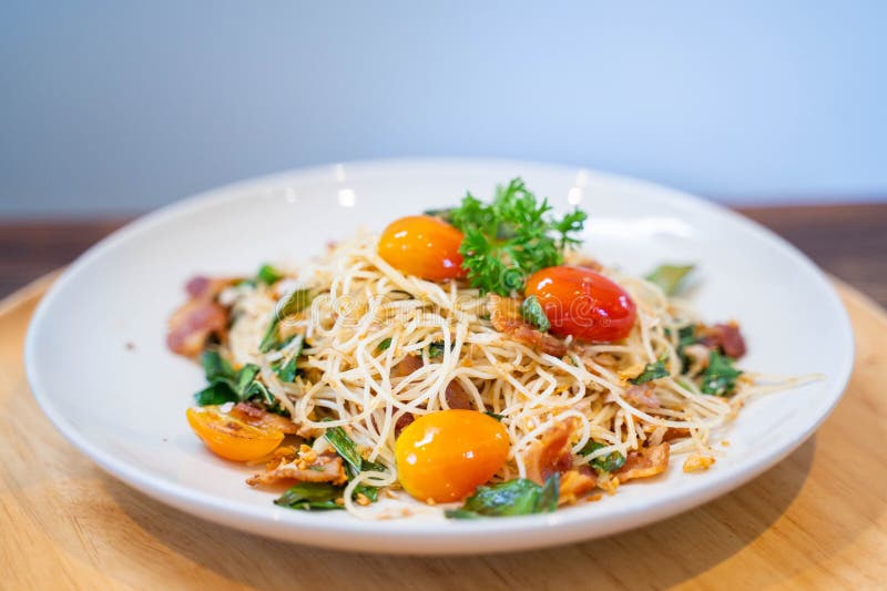 Stir Fried Spaghetti with Bacon Serve with Tomato Stock Image - Image ...