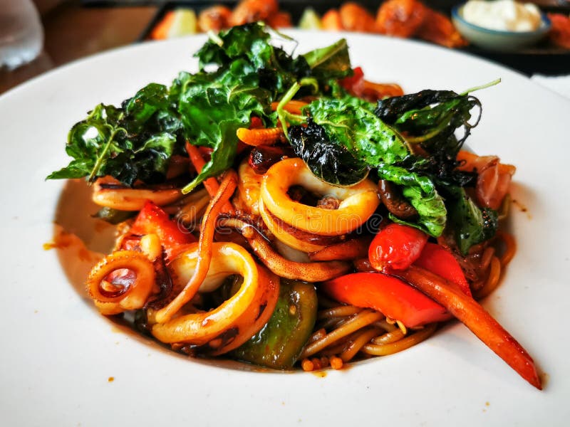 Stir Fried Spaghetti with Squid Stock Photo - Image of delicious, curry ...