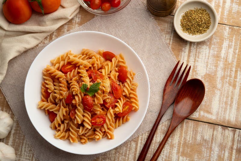 Stir Fried Trivelle Pasta with Tomatoes Sauce on a Plate. Stock Photo ...