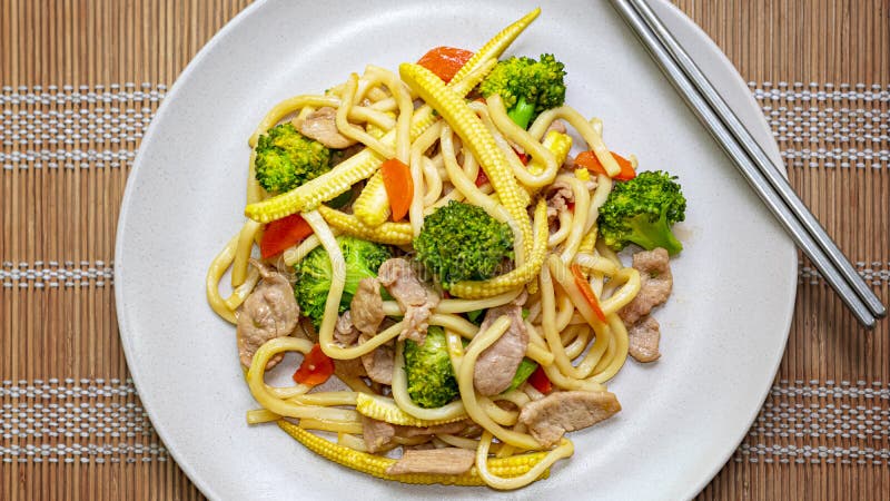 Stir-Fried Udon Noodles with Broccoli, Baby Corn and Carrots Stock ...
