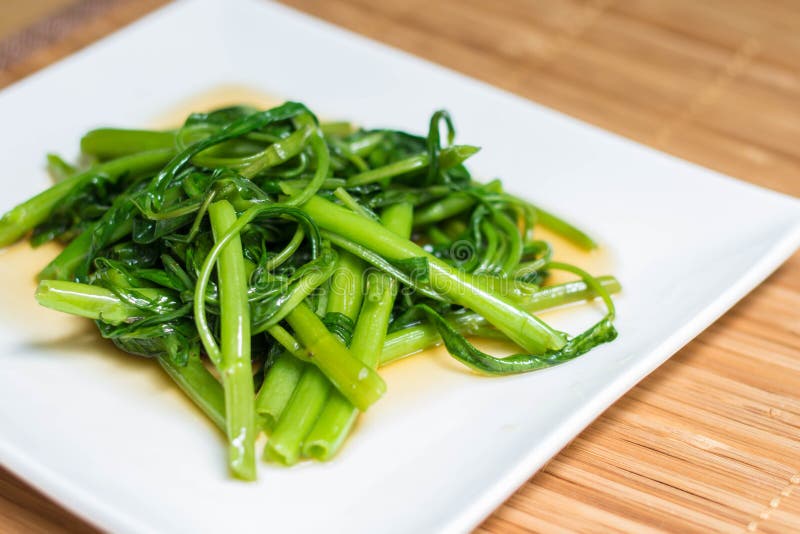 Stir Fried Water Spinach on Bamboo Mat Stock Photo - Image of fried ...