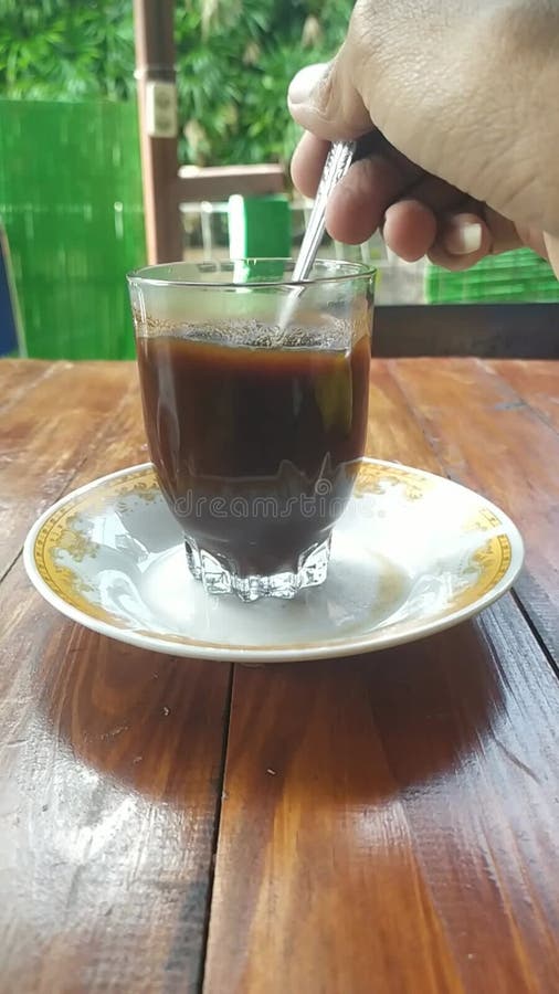 Stir a glass of coffee stock video. Video of glass, robusta - 382668123
