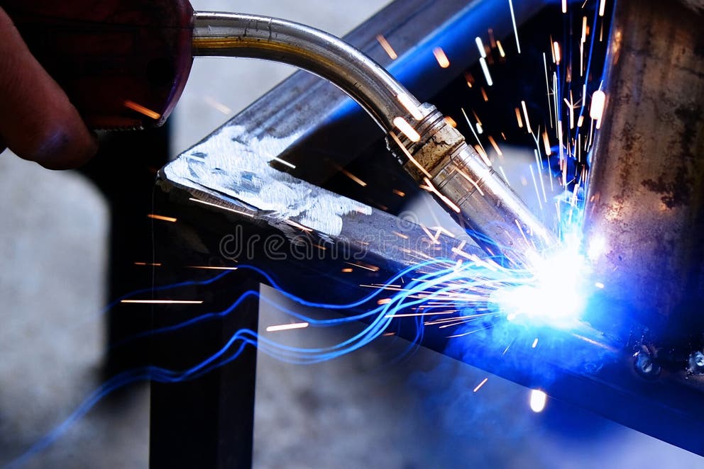 Welder Working with Arc Welding Machine To Weld Steel at Factory. Stock ...