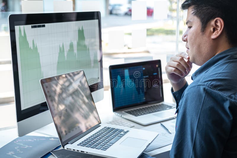 Stock Exchange Market Concept, Stock Broker Looking at Graph Working ...