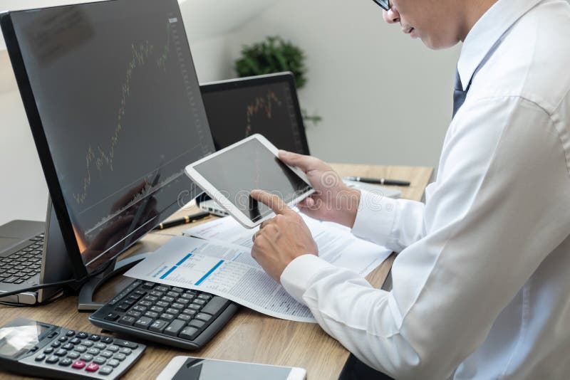 Stock Exchange Market Concept, Stock Broker Looking at Graph Working ...