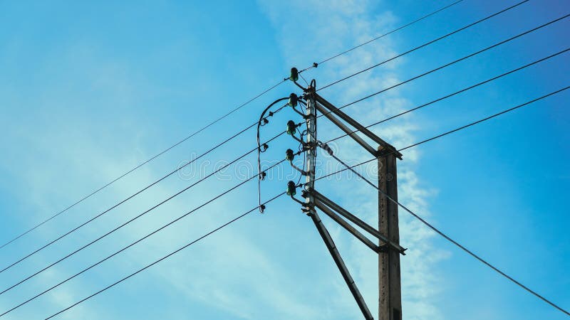 Urban Connections: Electric Post with Wires Spanning Across a Bustling ...