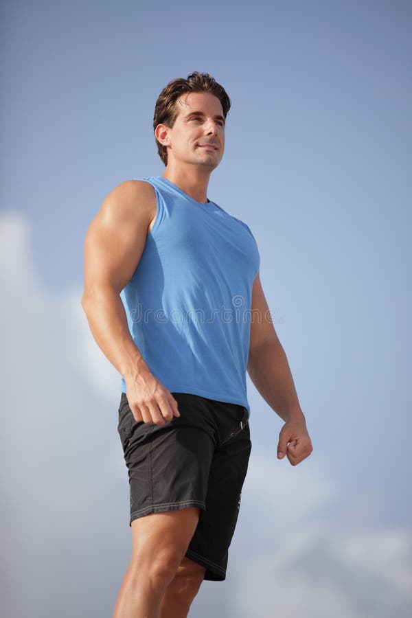 Young Man in Blue stock photo. Image of muscular, meeting - 804992