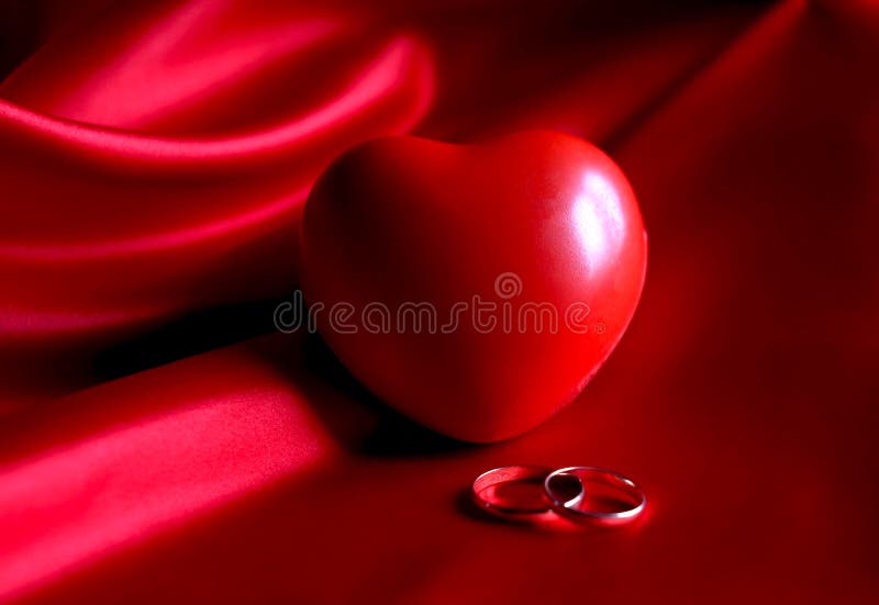 Stock Image of the Wedding Rings and Red Ribbon Stock Image - Image of ...