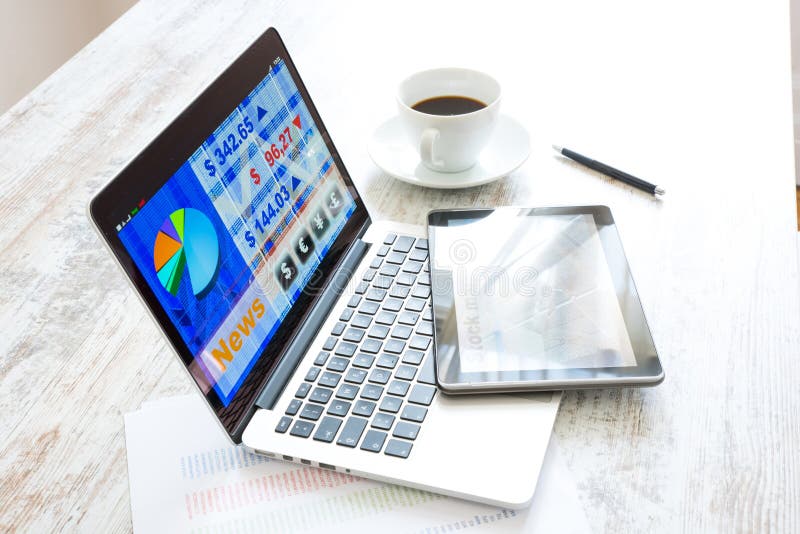 Stock Market Trading App on a Tablet PC and Laptop PC Stock Photo ...