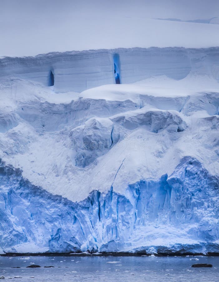 Big Iceberg with Cracks Floating on the Sea Stock Photo - Image of ...