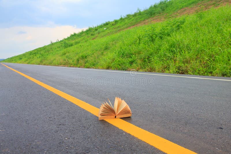 Stock Photo - Open Book on Road Outdoors Stock Photo - Image of ...