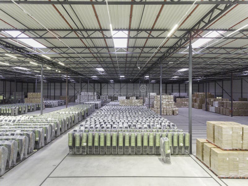 Stock piles in warehouse editorial stock image. Image of inside - 166375484