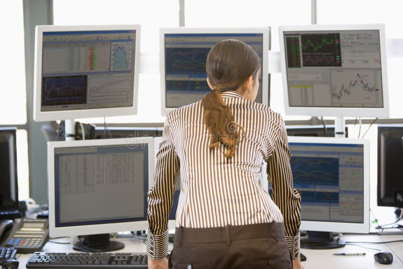 Stock Trader Looking at Multiple Monitors Stock Image - Image of rear ...