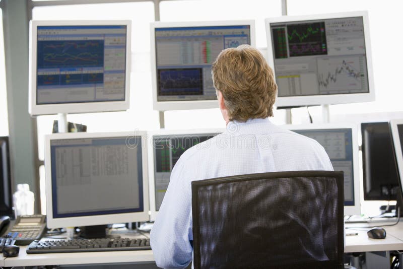Stock Trader Looking at Multiple Monitors Stock Image - Image of ...
