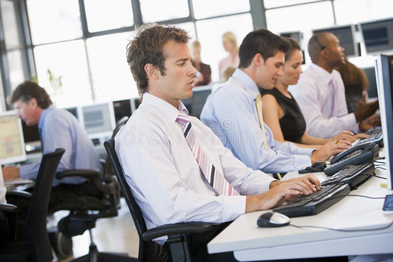 Stock Traders at Work stock image. Image of group, sitting - 10400265