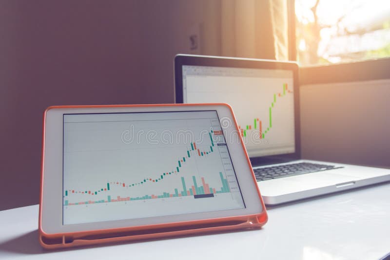 Stock Trading Forex on Tablet and Laptop on a White Table Stock Image ...