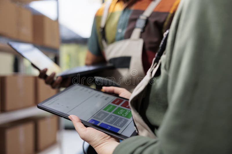 Stockroom Colleagues Analyzing Inventory Report on Tablet Stock Image ...