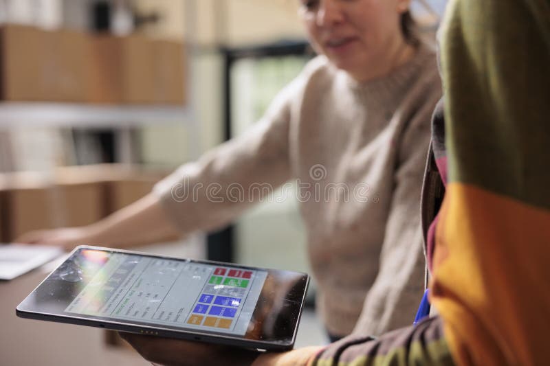 Stockroom Team Analyzing Online Orders on Tablet Computer Stock Image ...