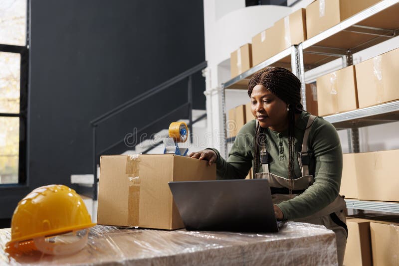 Stockroom Worker Analyzing Goods Inventory Report Stock Image - Image ...