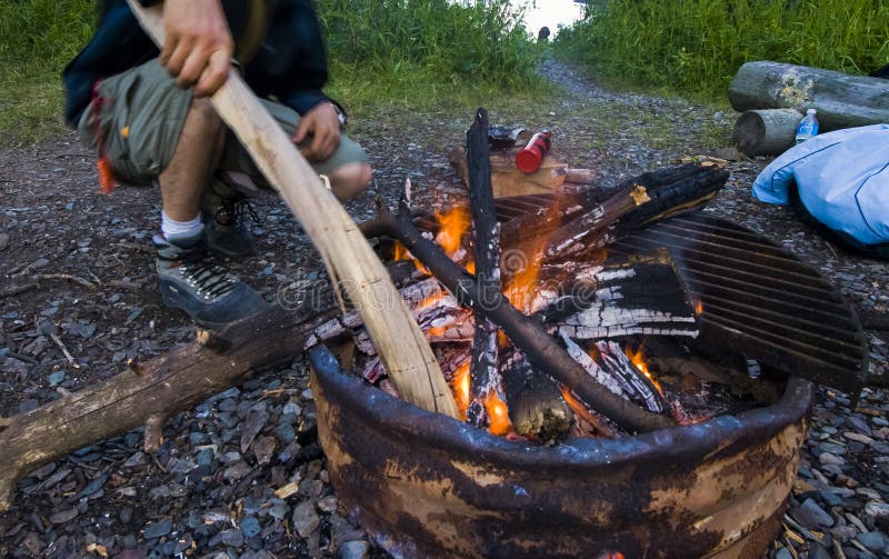 Stoking the Campfire stock image. Image of wilderness - 35986517