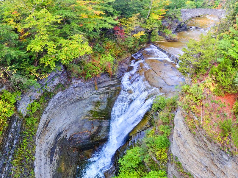 Stone Arch Bridge Over River Leading To Huge Waterfall into Gorge Stock ...