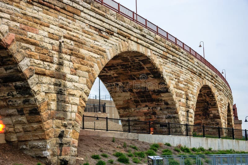 A Stone Arch Bridge with a Red Railing Stock Image - Image of railway ...