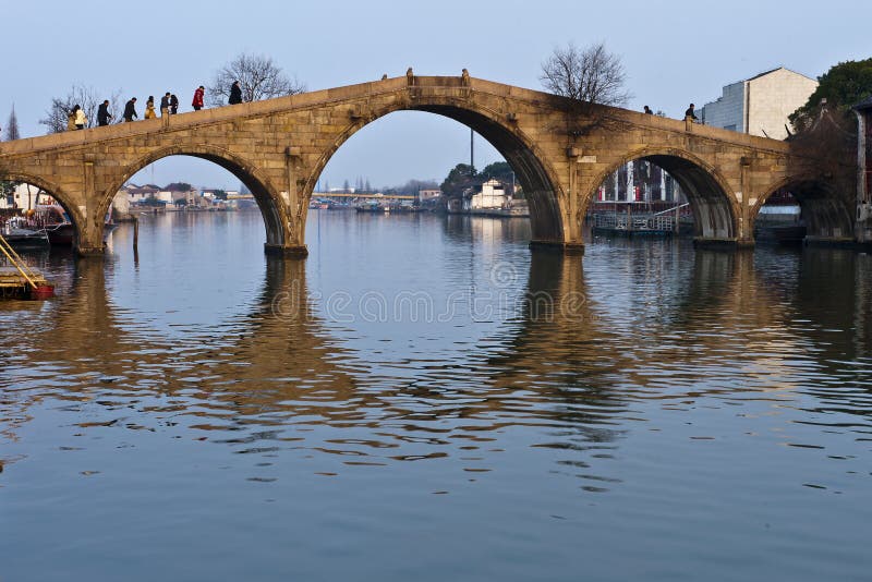 Stone Arch Bridge Reflection in Pond Stock Photo - Image of path ...