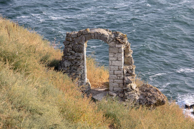Stone Arch on the Edge of the Mountain Over the Ocean Stock Image ...
