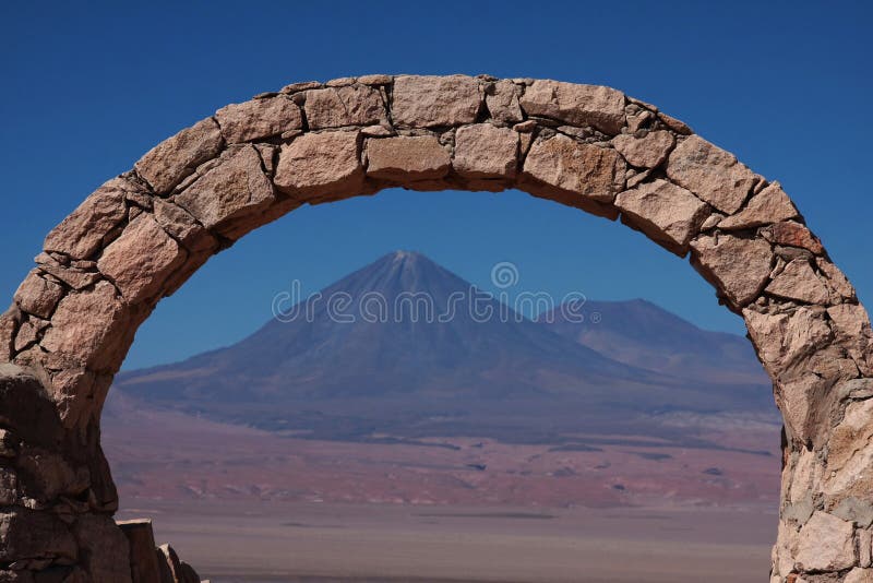 Stone Arch in Front of a Volcano in Chile Stock Image - Image of chile ...