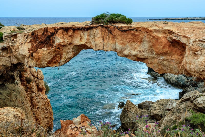 Stone arch over coastline stock image. Image of greco - 28870779