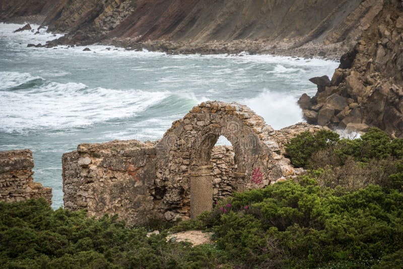 Stone Arch Surrounded by Foliage by a Seashore Stock Image - Image of ...
