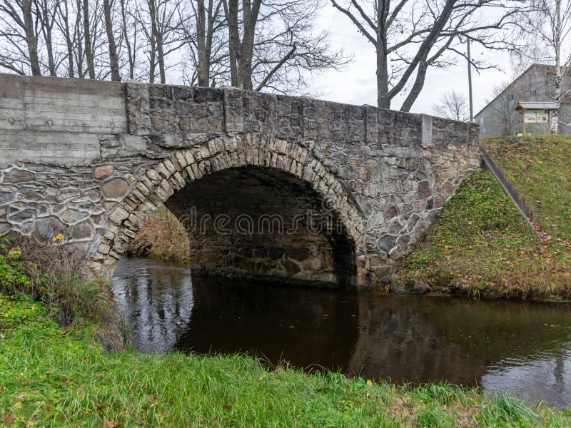 Stone Arched Bridge Over the Small River, Autumn Day Stock Image ...