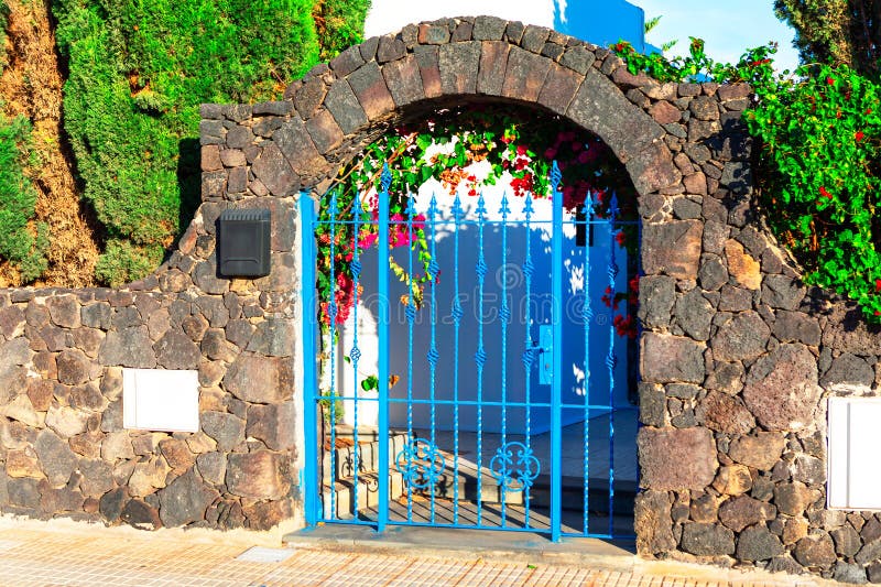 Stone Archway with a Blue Metal Gate Stock Image - Image of artistry ...