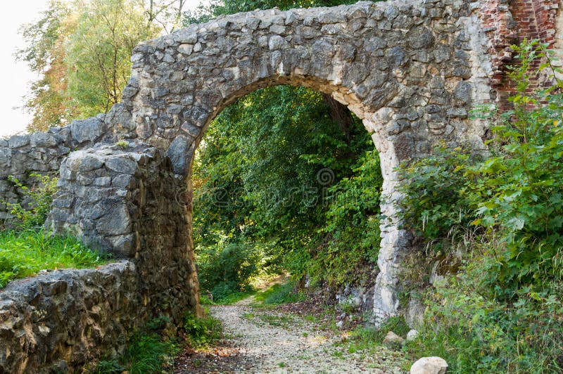 Stone Archway in Lush Greenery on a Rocky Path Stock Photo - Image of ...