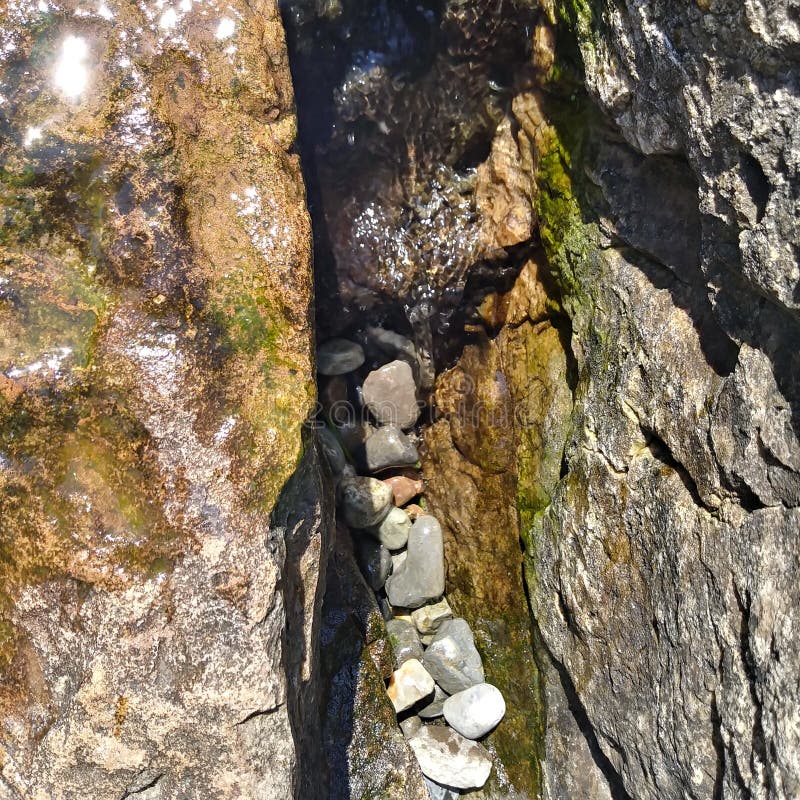 Water Falling from Rocks Over Pebbles Details Closeup Stone Art Stock ...