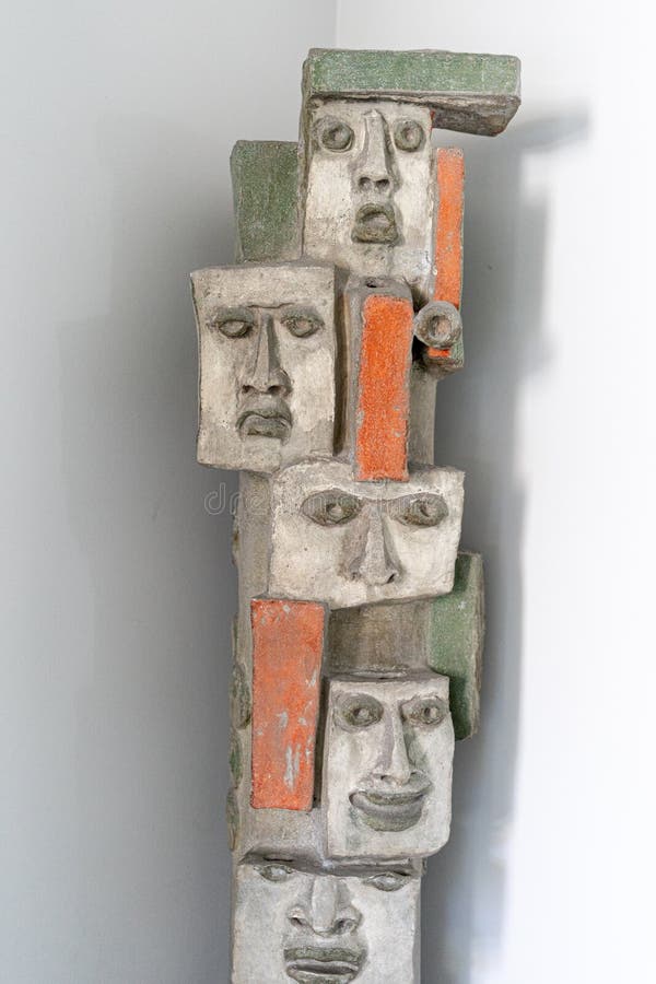 Stone Artwork of Human Faces Stacked in a Column. Editorial Photo ...